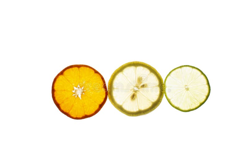 Three Slices of Lemon, Tangerine and Lime Fruit with Light Shining ...