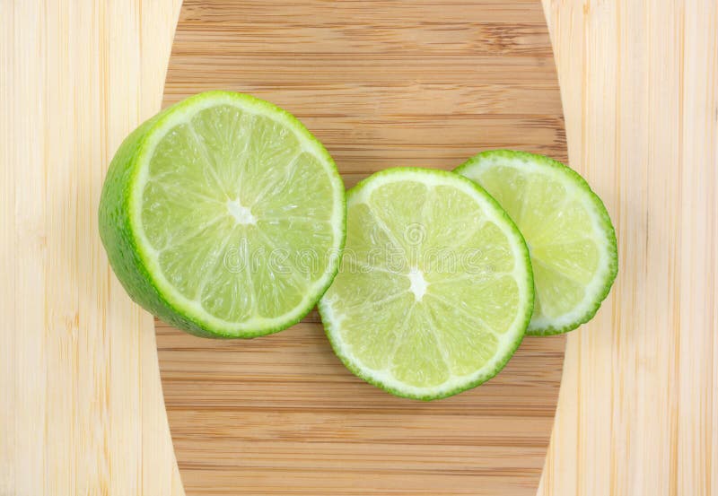 Three Slices of Tart Green Limes Up Close Stock Photo - Image of light ...