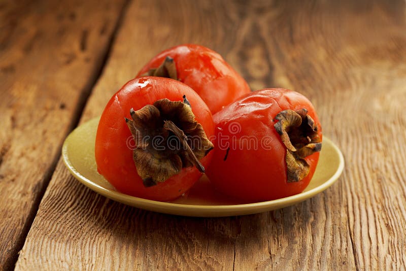 Three Slightly Overripe Persimmon Stock Photo - Image of orange, sweet ...
