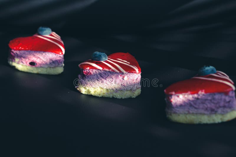 Three Small Cakes in the Shape of a Heart, Illuminated by the Sun S ...