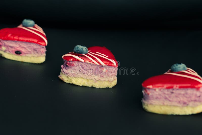 Three Small Cakes in the Shape of a Heart, Illuminated by the Sun S ...