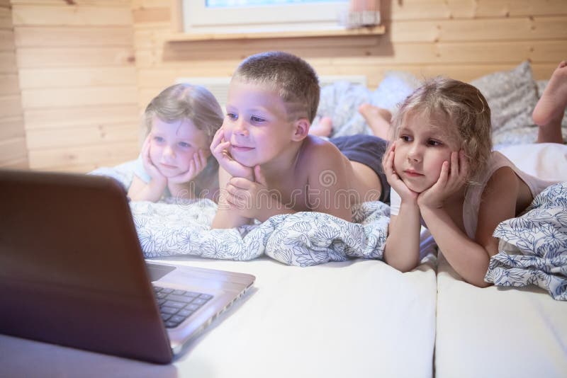 Three Small Children Looking at Laptop Screen Stock Photo - Image of ...