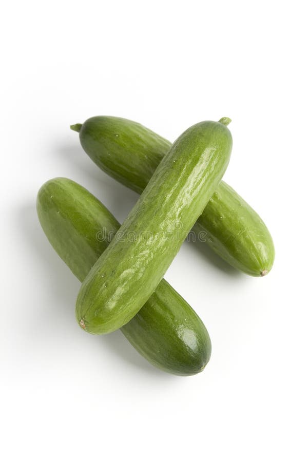 Small cucumbers on a row stock photo. Image of healthy - 12099280