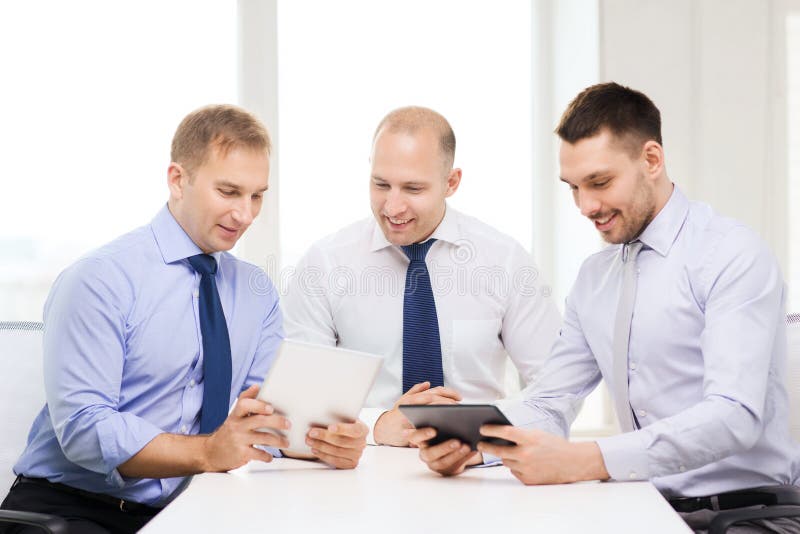 Three Smiling Businessmen with Tablet Pc in Office Stock Image - Image ...