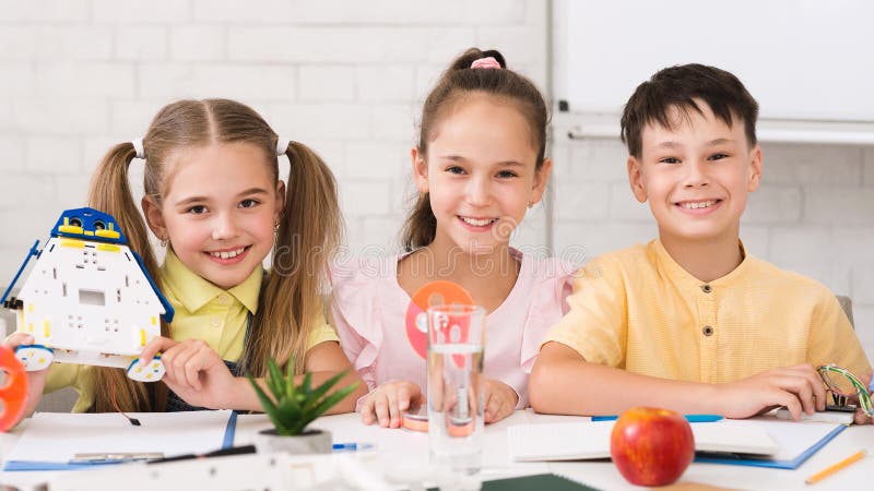 Three Smiling Children Working on STEM Project in Classroom Stock Image ...