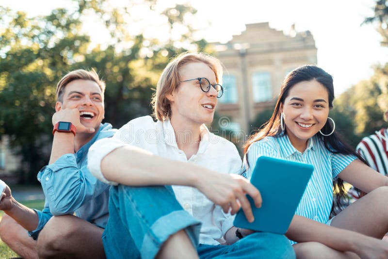 Three Smiling Groupmates Relaxing after Classes Outside. Stock Image ...