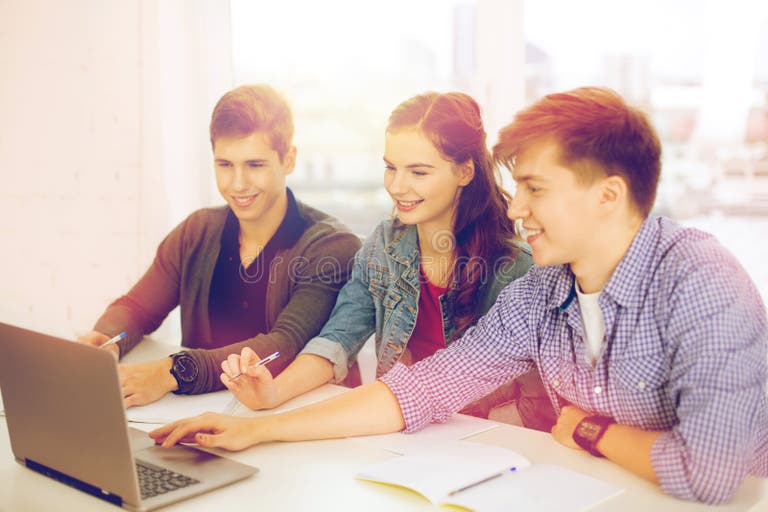 Three Smiling Students with Laptop and Notebooks Stock Image - Image of ...
