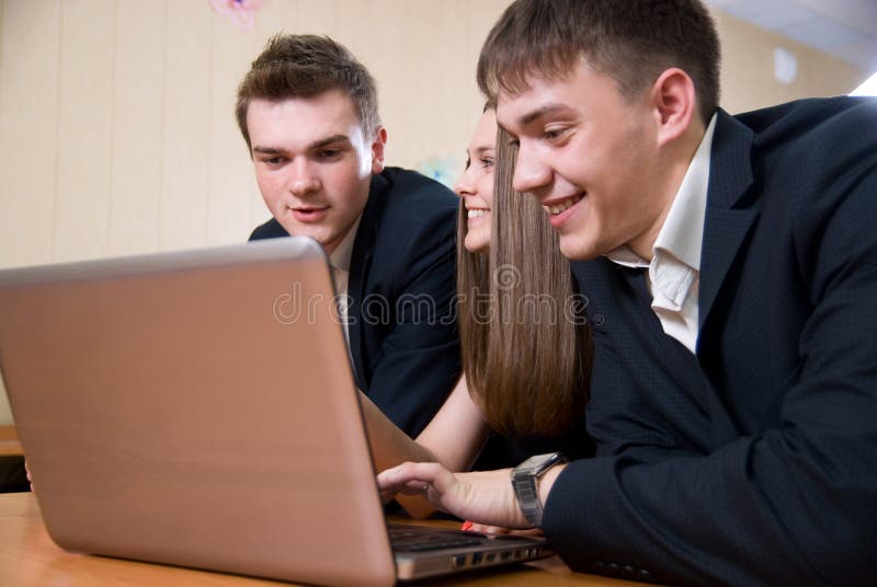Three Smiling Young Businessmen with Laptop Stock Photo - Image of ...