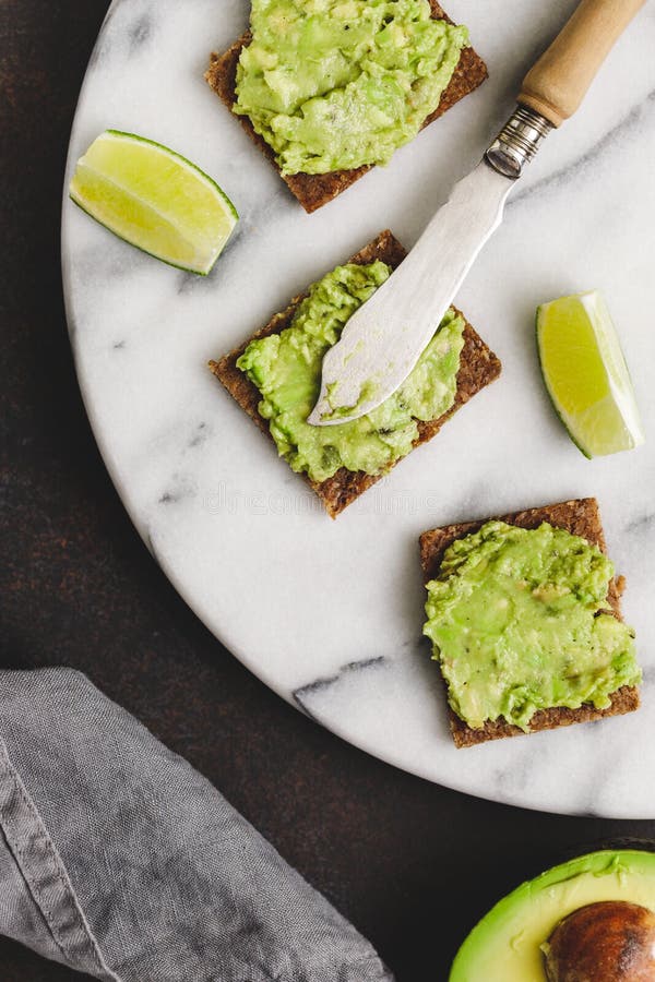 Three Snacks with Rye Bread and Mashed Avocado on a White Marble Tray ...