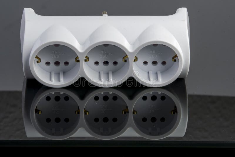 Three Socket Strips in White on Mirror Table Stock Photo - Image of ...