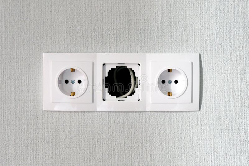 Three Sockets Located Under the TV on the Wall. Stock Image - Image of ...