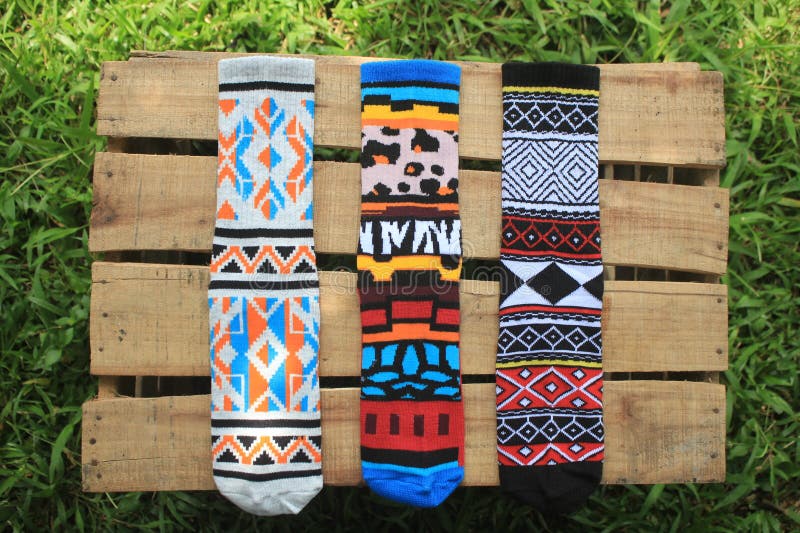 Three Socks with a Variety of Different Patterns Placed on a Wooden ...