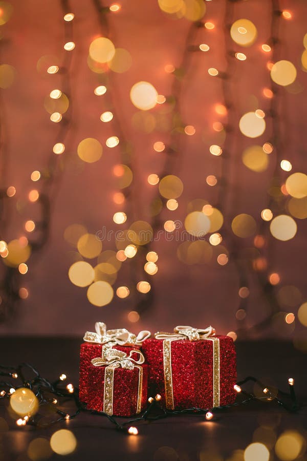 Three Sparkly Present Boxes with Bokeh and Fairy Lights Stock Photo ...