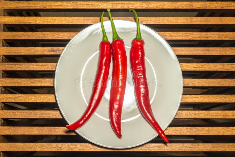 Three spicy chilli peppers stock image. Image of food - 34652585