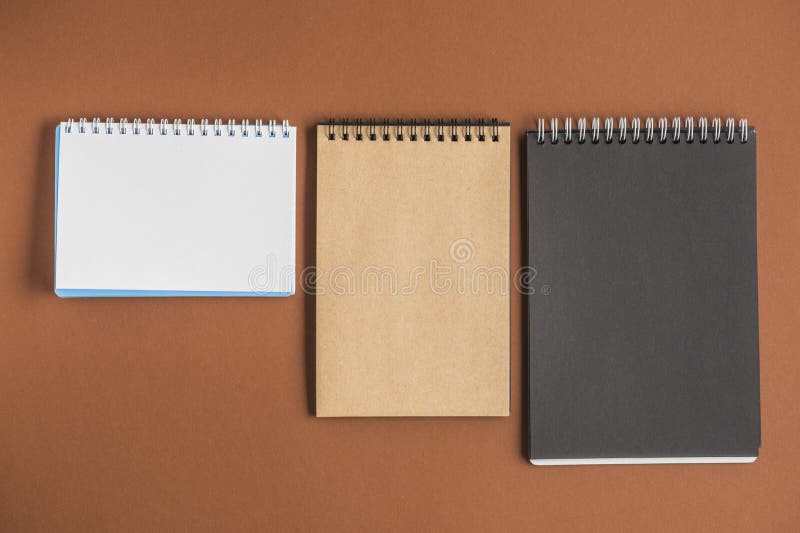 Three Spiral Notebooks Brown Backdrop. High Quality Beautiful Photo ...
