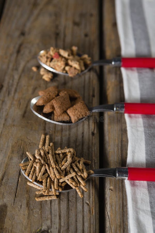 Three Spoons with Various Breakfast Cereals Stock Photo - Image of ...