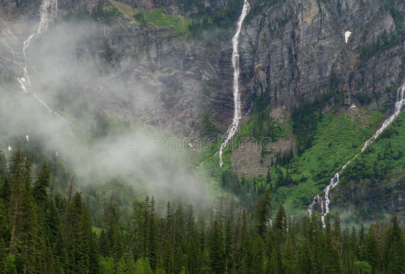 Three Spring Waterfalls Drop into Foggy Valley Stock Photo - Image of ...