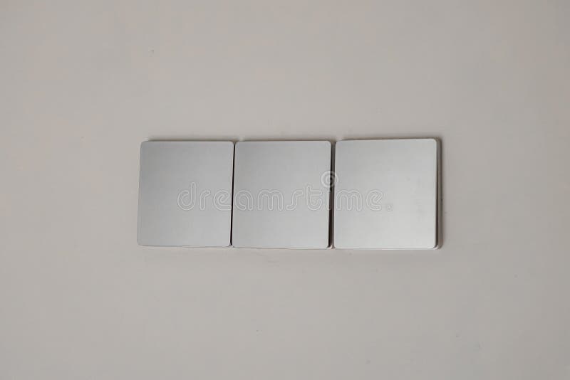 Three Square Switch Buttons on a White Wall Stock Image - Image of wood ...