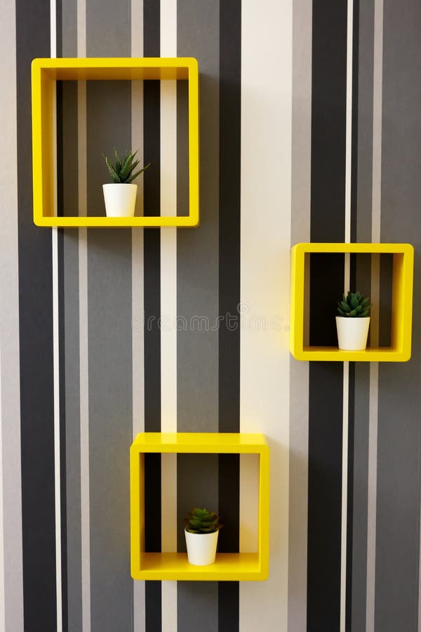 Three Square Yellow Shelves on a Striped Wall. Inside Indoor Plants ...