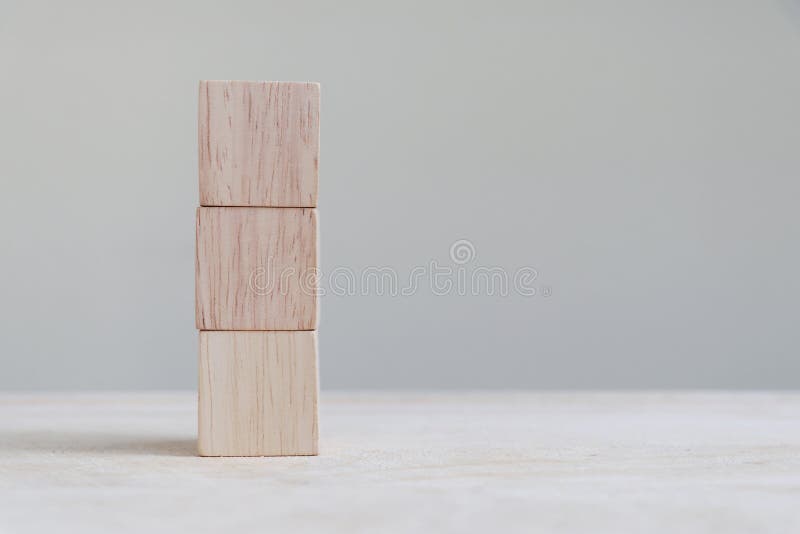 Three Stacked Wooden Cubes with Copy Space on the Right. Stock Photo ...