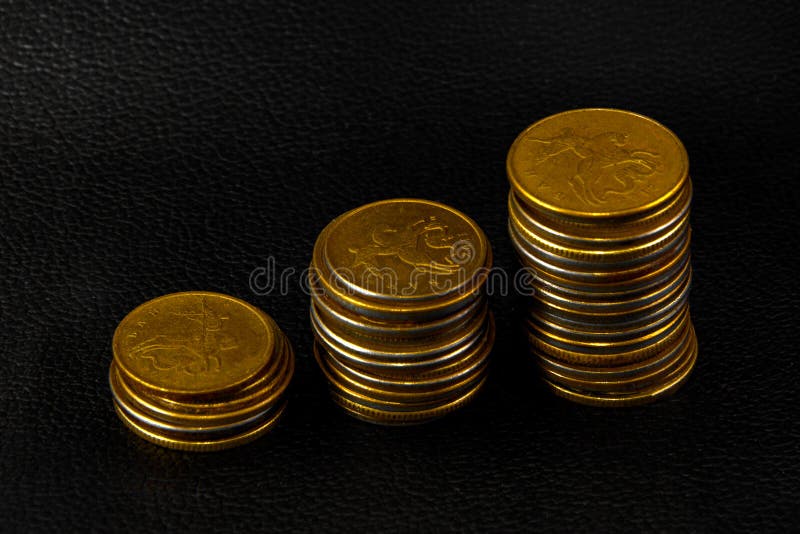 Three Stacks of Coins on Black Leather Stock Image - Image of concept ...
