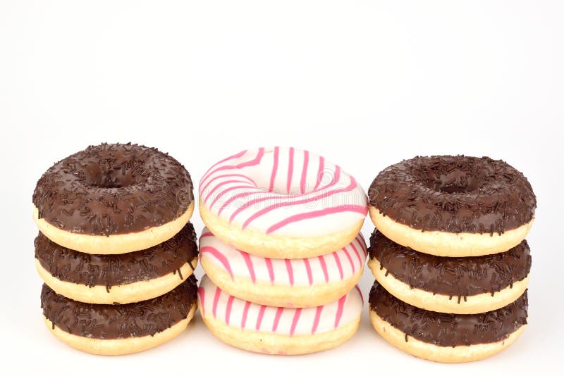 Three Stacks of Donuts in Chocolate and White Glaze. Three Donuts in ...