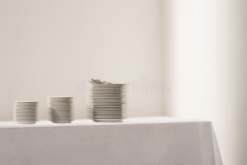 Three Stacks of Plates and Cutlery on Table Stock Photo - Image of bowl ...