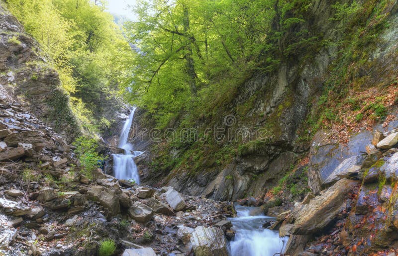 Three-stage Waterfall in the Spring in the Mountains Stock Photo ...