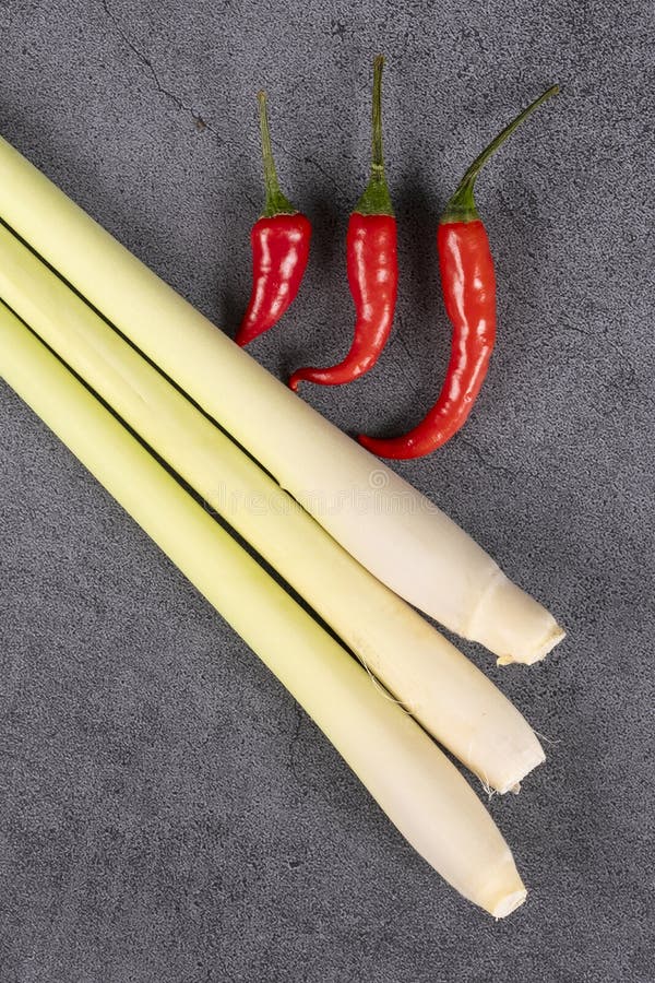 Three Stalks of Lemon Grass and Three Hot Red Chili Peppers Stock Photo ...