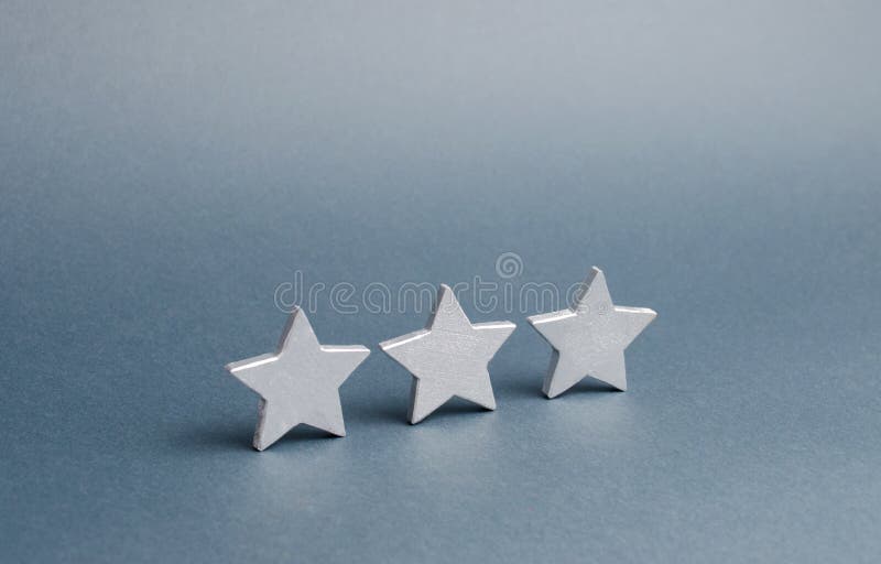 Three Stars on a Gray Background. the Concept of Rating and Evaluation ...