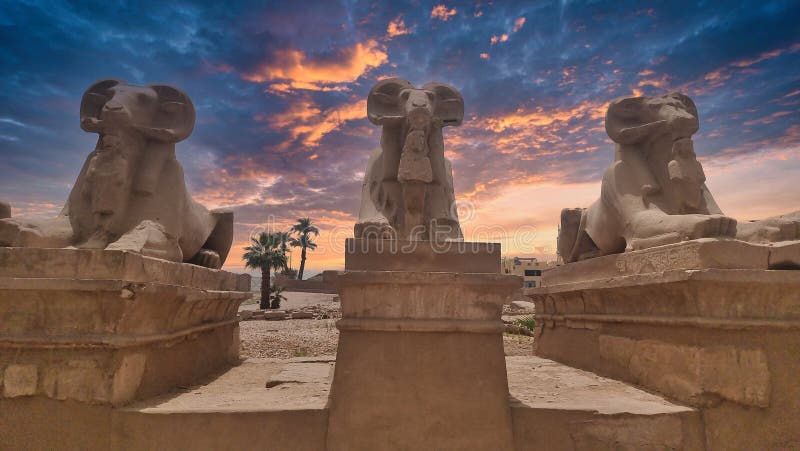 Three Statues Against a Vibrant Sunset Sky Editorial Stock Photo ...