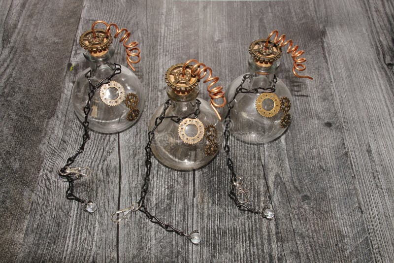 THREE STEAMPUNK HANDCRAFTED BOTTLES, Stock Image - Image of metal ...