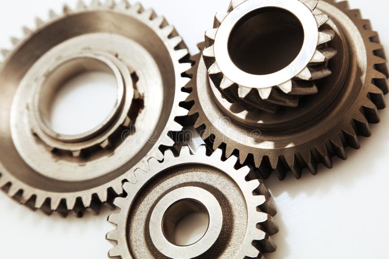 Three steel cog gears stock image. Image of engineering - 262124689