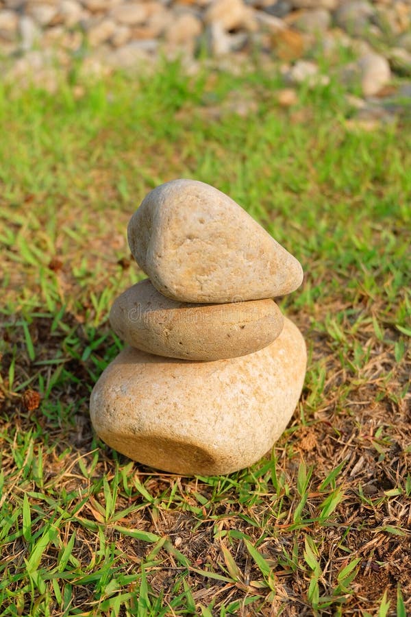 Three Stone with Perfect Balance Stock Photo - Image of grass, perfect ...