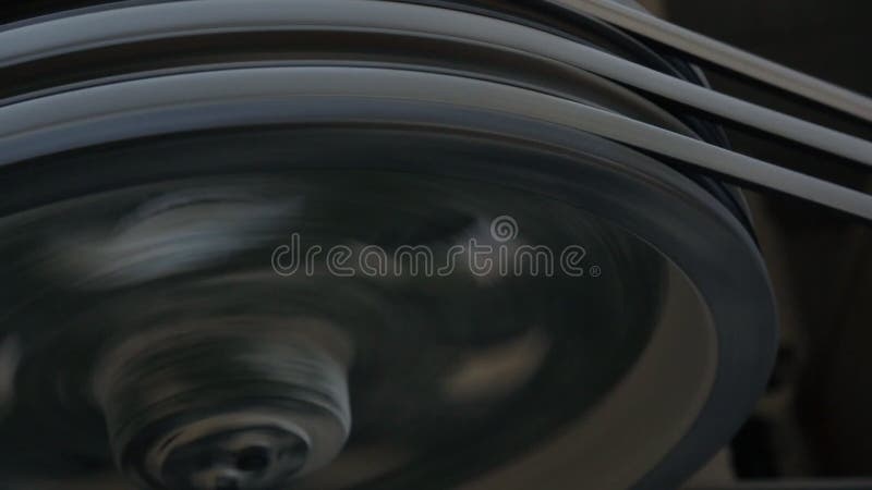 Three-strand Pulley with Belts Rotates from Powered Electrical Engine ...