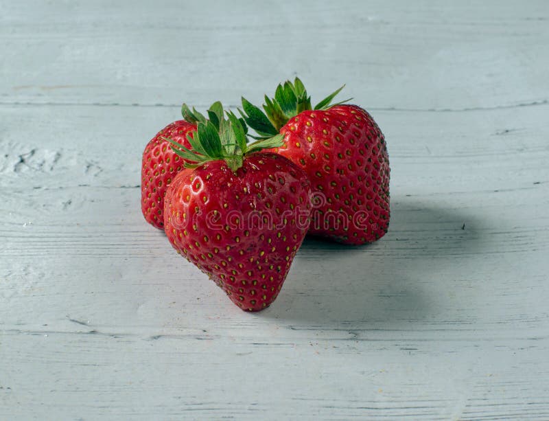 Three Strawberriesarranged on a White Back Ground Stock Image - Image ...