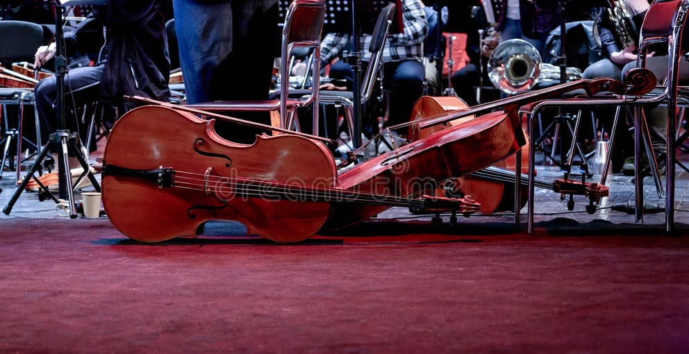 Three Stringed Musical Instruments Cello Lie on the Stage Stock Image ...