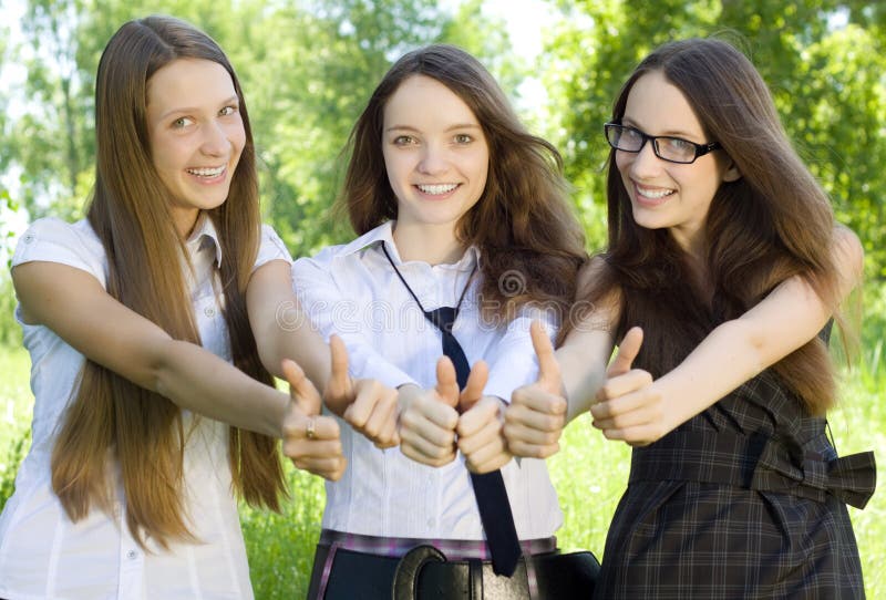 Three Student Girl with Thumbs-up in the Park Stock Photo - Image of ...