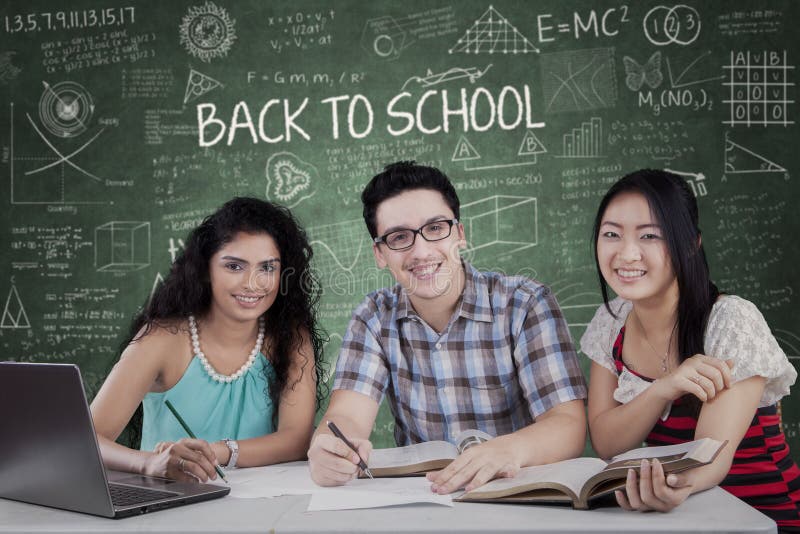 Three Students with Assignment in the Class Stock Photo - Image of back ...