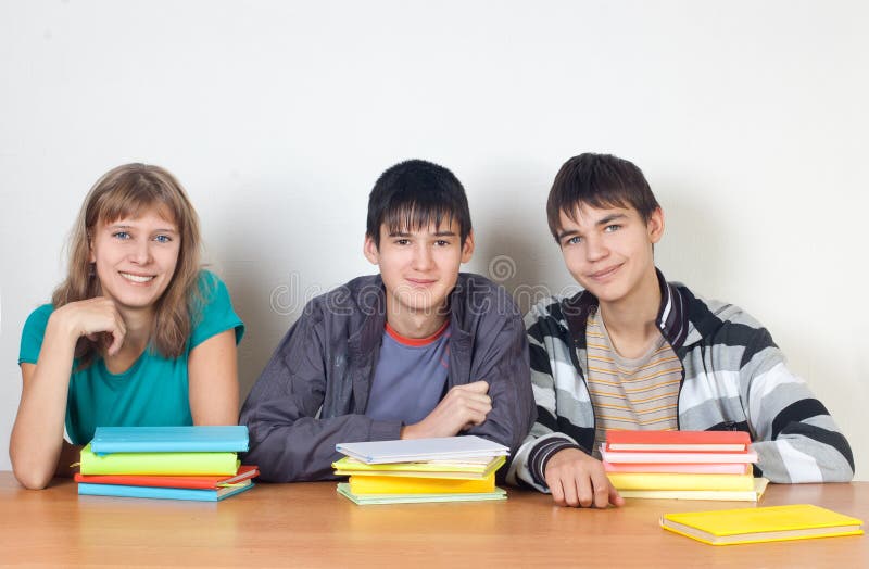 Three students with books stock photo. Image of friends - 17841054