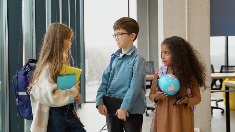 Three Diverse Pupils Communicate in the Class after the Lesson Stock ...