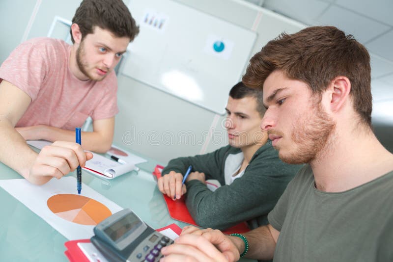 Three Students Communicating in Classroom Stock Image - Image of people ...