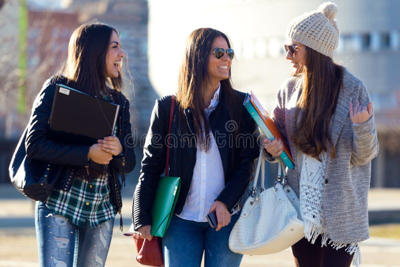 Three Students Girls Walking in the Campus of University. Stock Photo ...