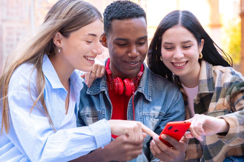 Three Students Having Fun with Mobile Phones Creating Content on Social ...