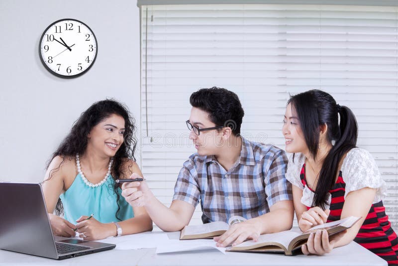 Three Students and Homework Stock Image - Image of holding, beautiful ...