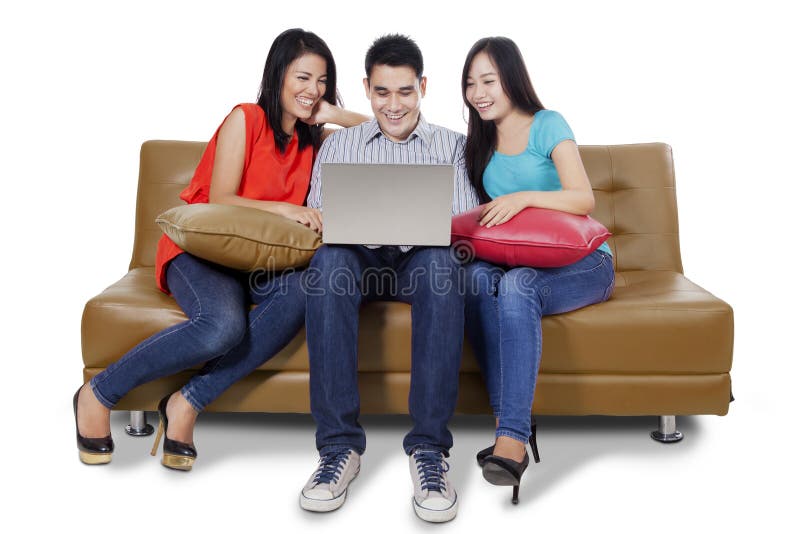 Three Students and Laptop on the Couch Stock Image - Image of college ...