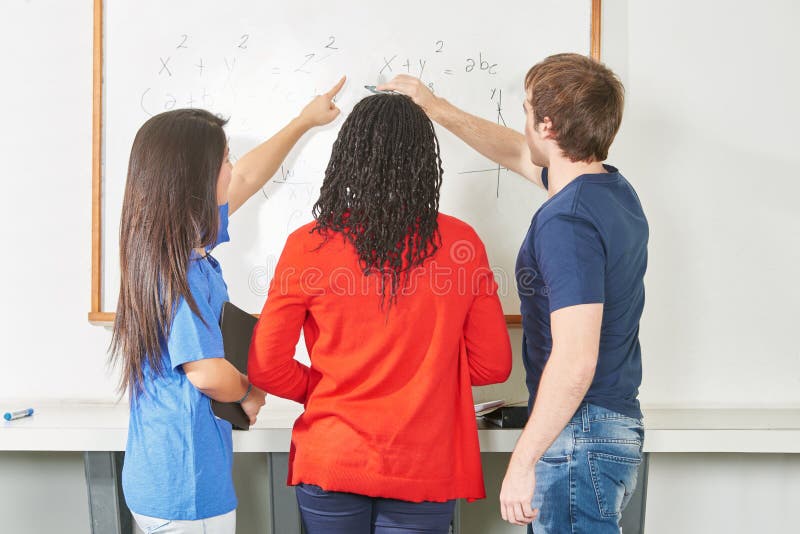 Three students learn math stock image. Image of finger - 76411025