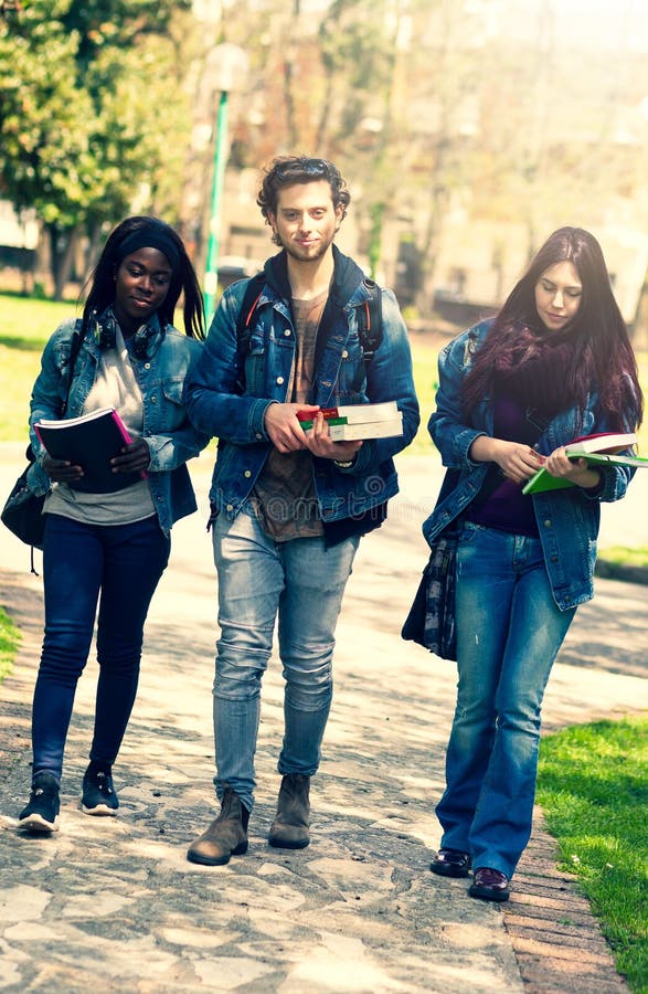 Three Students in the Outdoor Park Stock Photo - Image of campus, adult ...