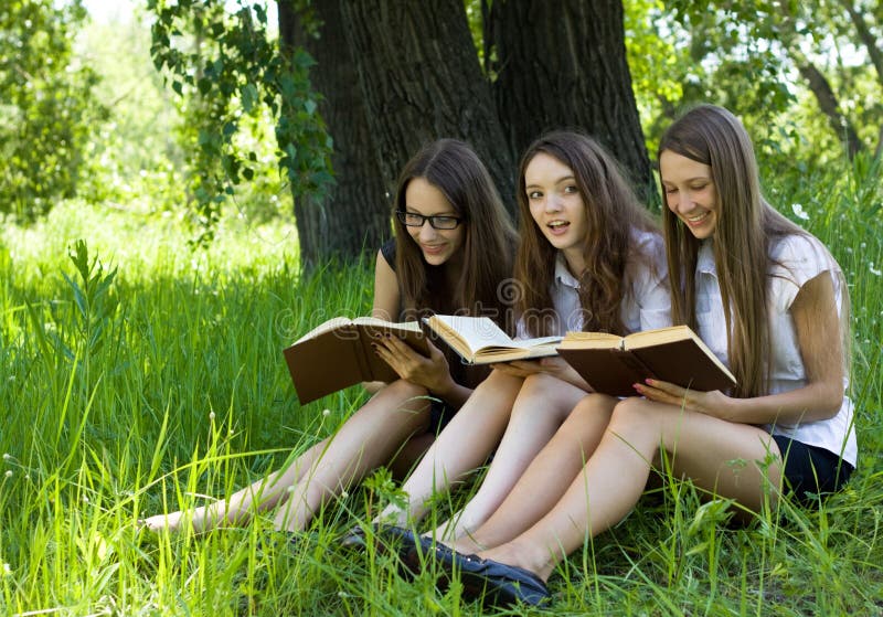 Three Students Reading Books Outdoor Stock Photo - Image of caucasian ...