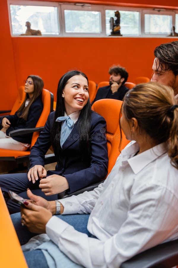 Students Smiling and Talking during a Lecture Stock Image - Image of ...